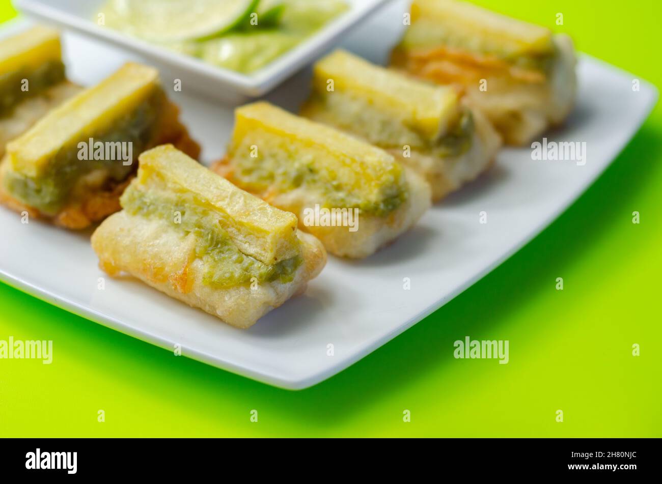 Skinless and boneless battered Alaska Pollock fillet pieces, topped ...