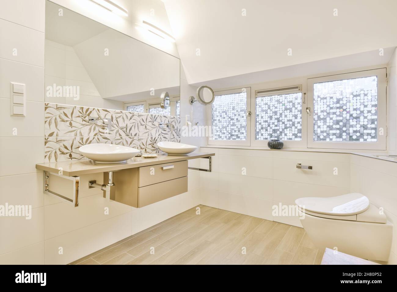 Design of restroom with toilet and two sinks Stock Photo - Alamy