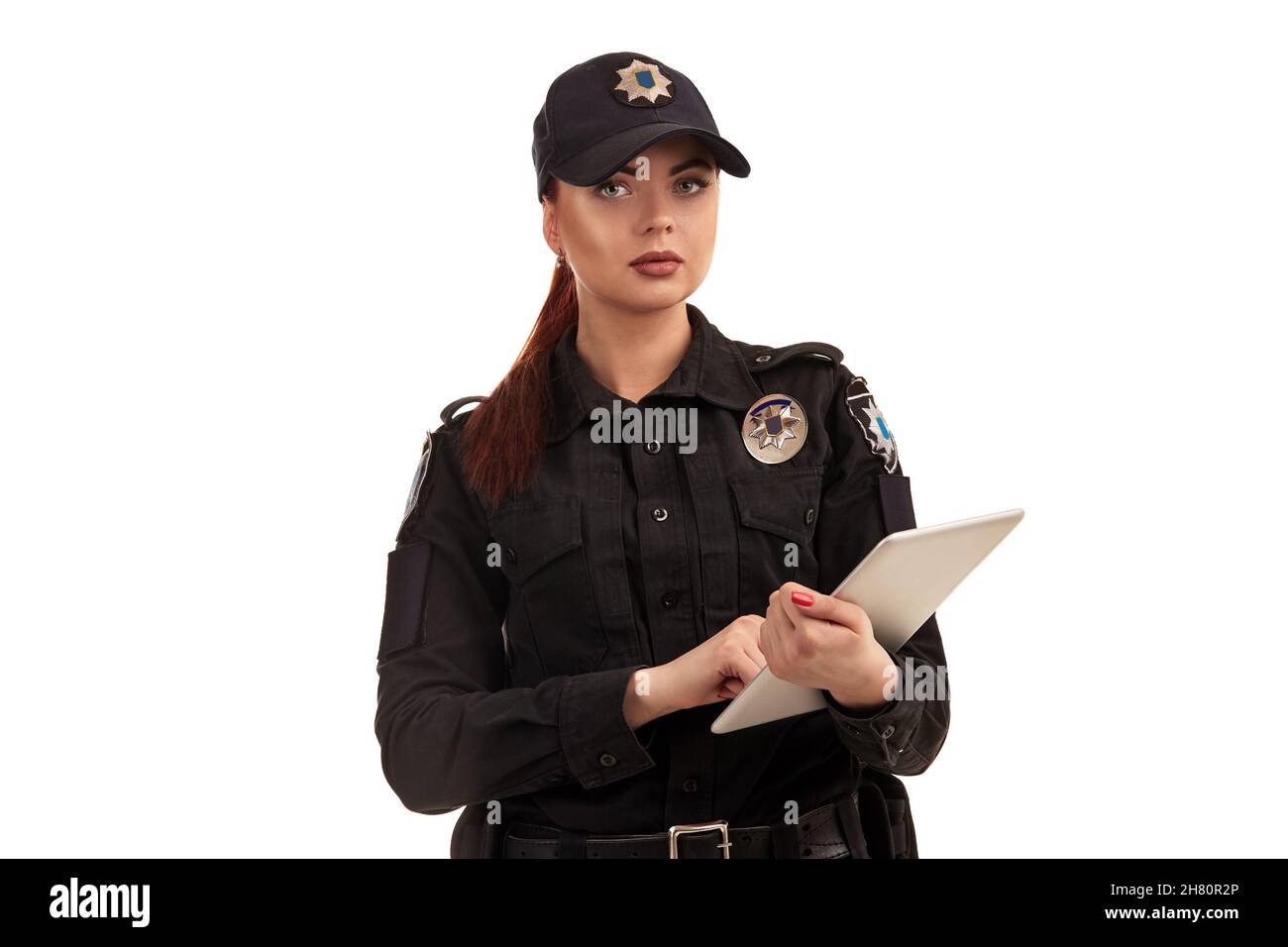 Close-up portrait of a female police officer is posing for the camera ...