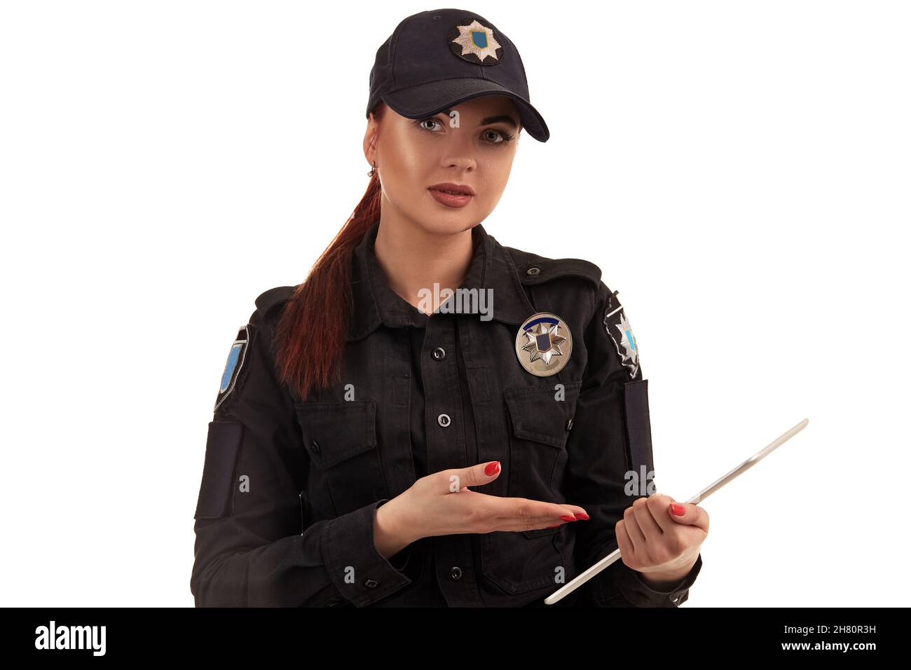 Close-up portrait of a female police officer is posing for the camera ...