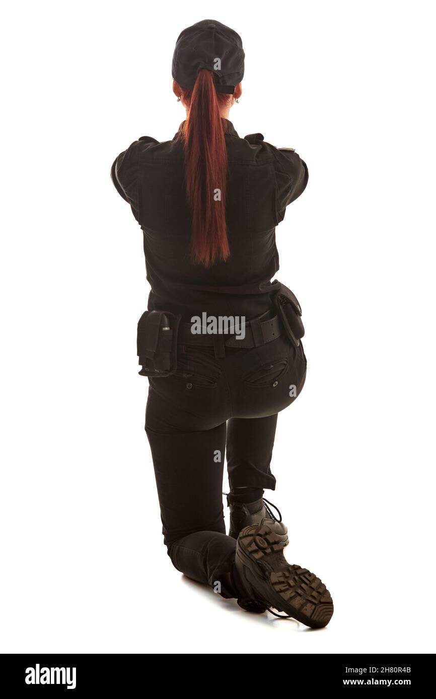 Close-up portrait of a female police officer is posing for the camera ...