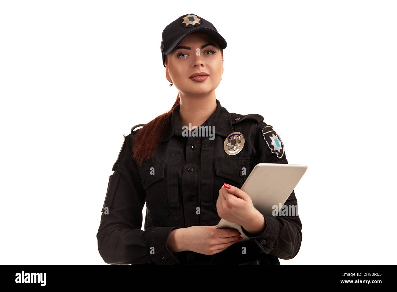 Close-up portrait of a female police officer is posing for the camera ...