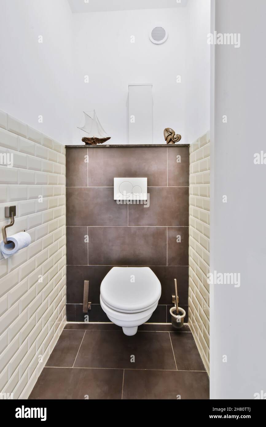 Interior of small clean restroom in miniature style Stock Photo - Alamy