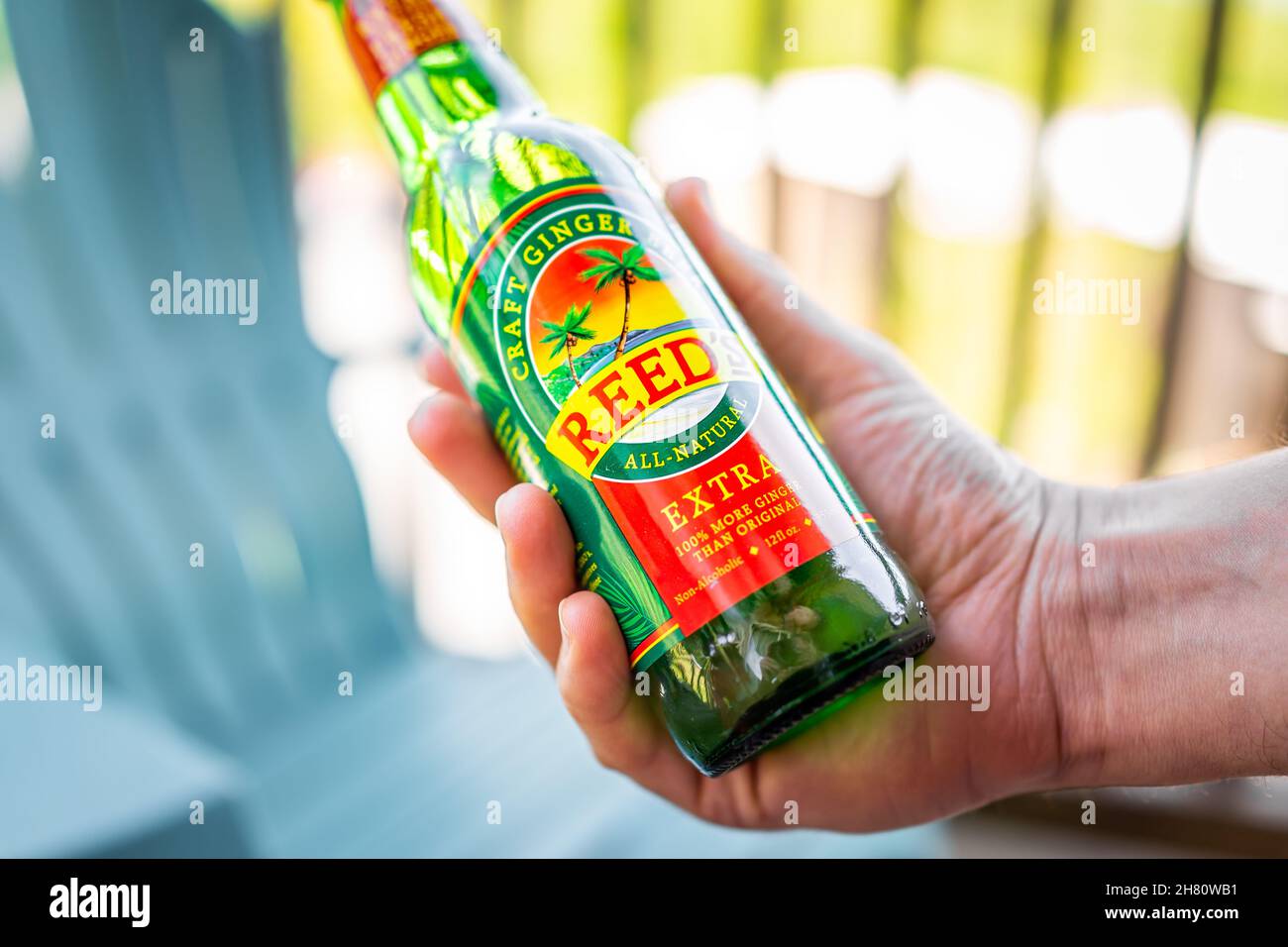 Sugar Mountain, USA - May 31, 2021: Closeup of glass bottle with hand ...