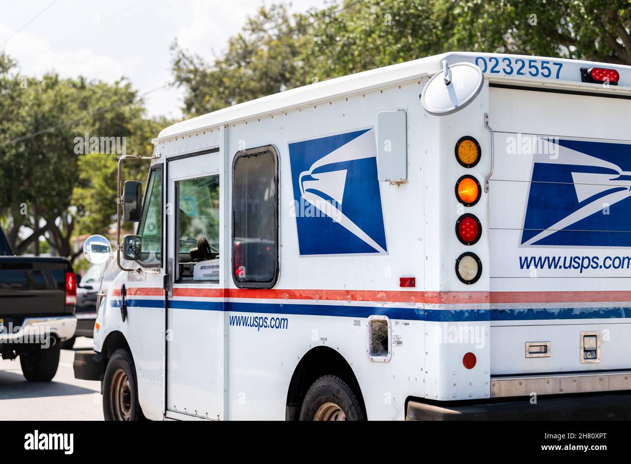 West Palm Beach, USA - July 8, 2021: Small USPS van truck delivering ...