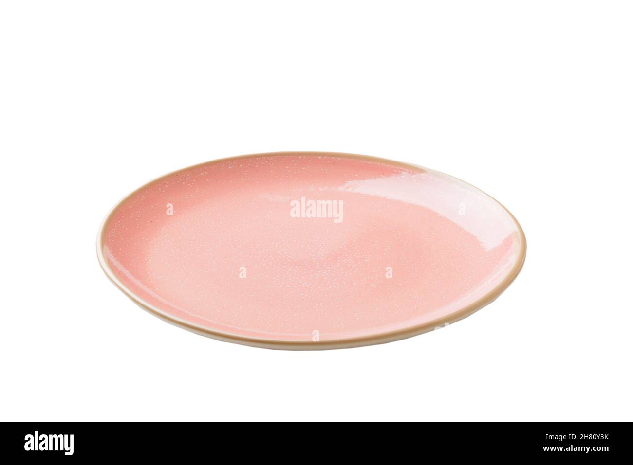 Pink ceramic round plate isolated over white background. perspective ...