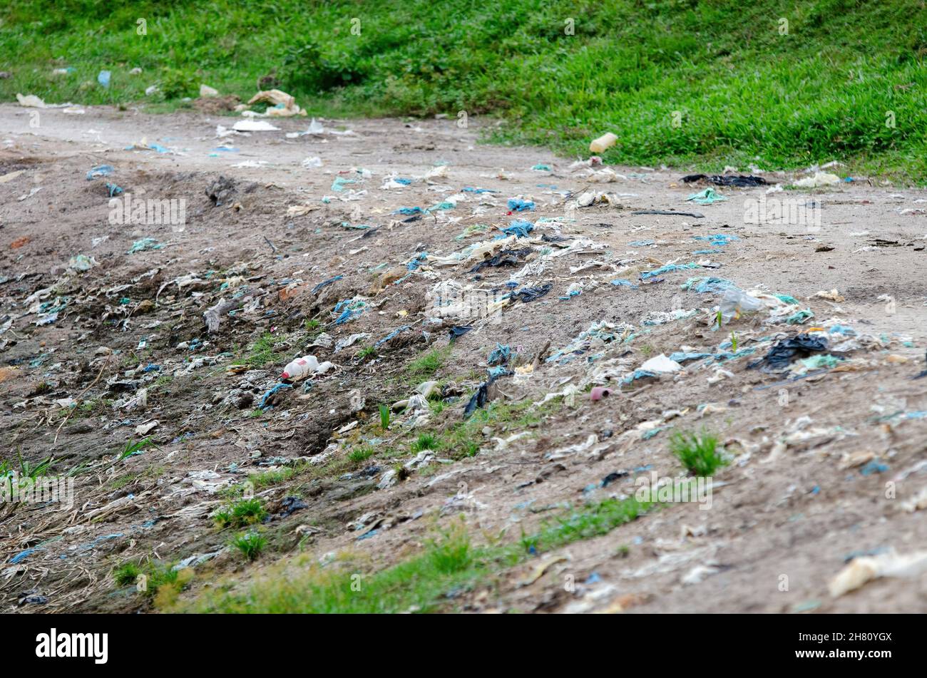 View of the plastic waste on the rural path. Environment pollution ...