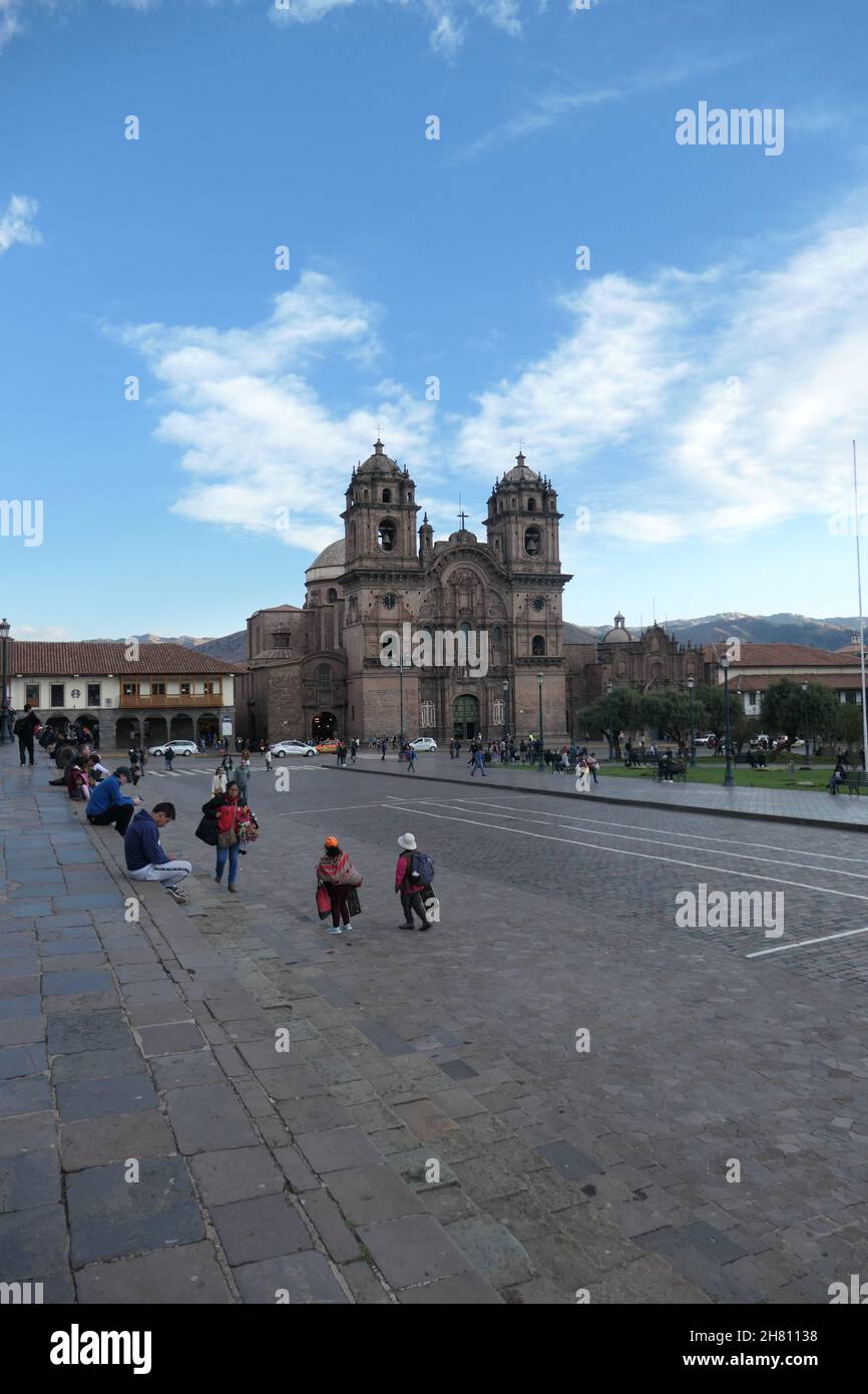 Cuzco Peru centre of town people sitting on steps Cathedral Church ...