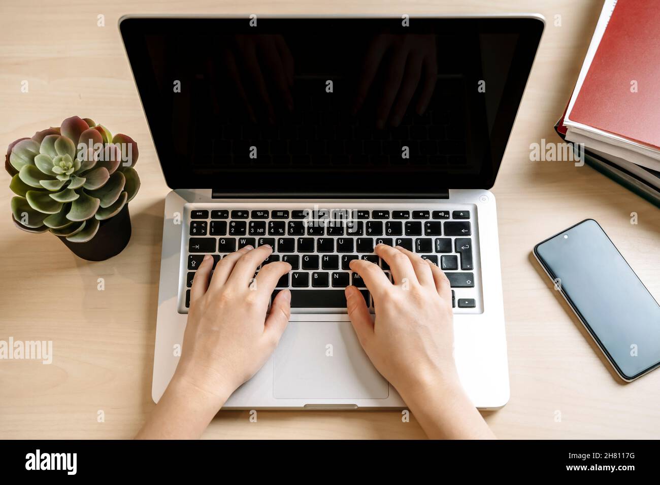 Laptop and hands on workplace background. Typing text on a computer ...