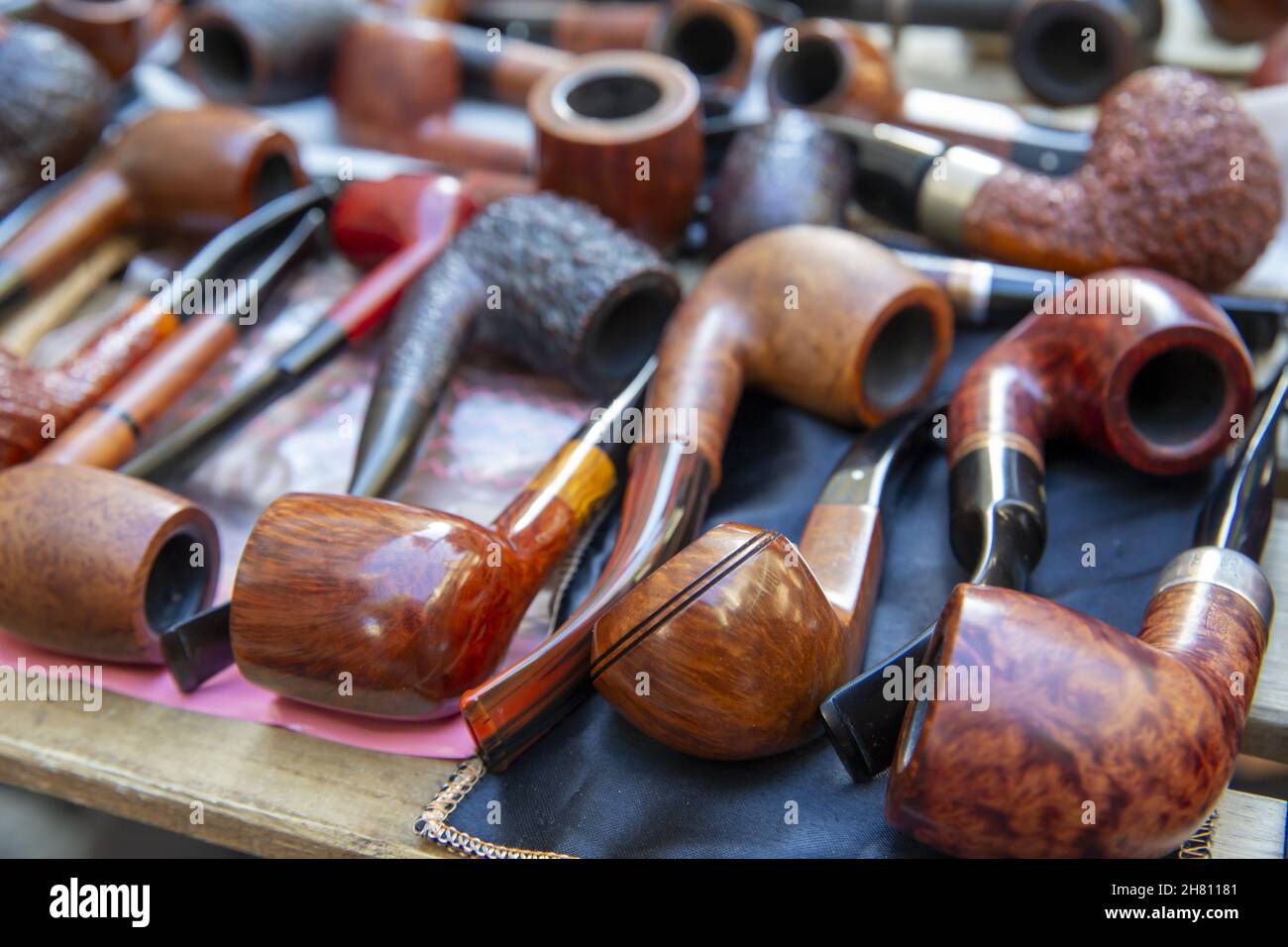 Closeup of smoking tobacco pipes in a market Stock Photo - Alamy