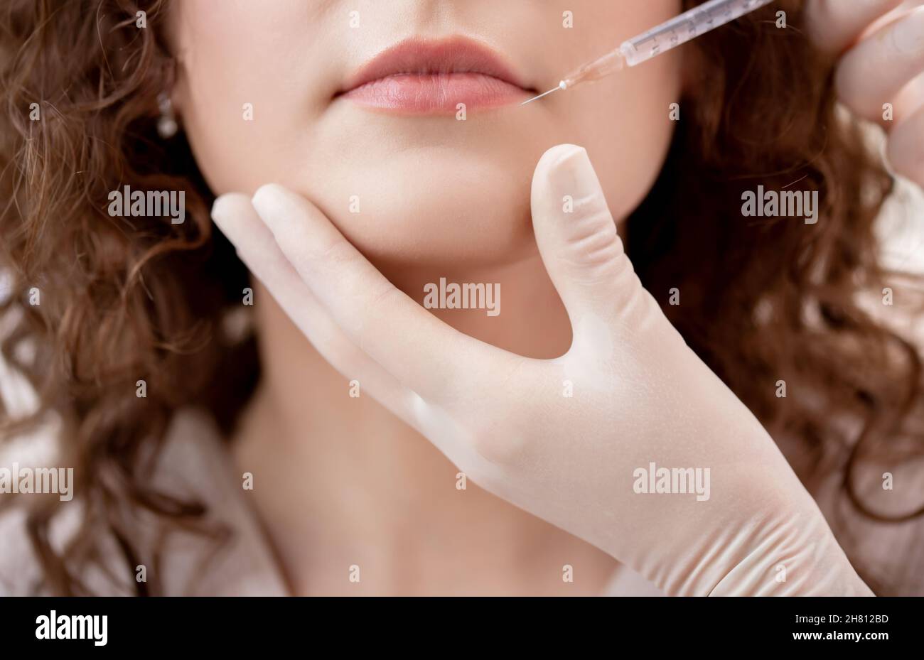 Macro process Lips filler injections for young woman. Beauty plastic ...