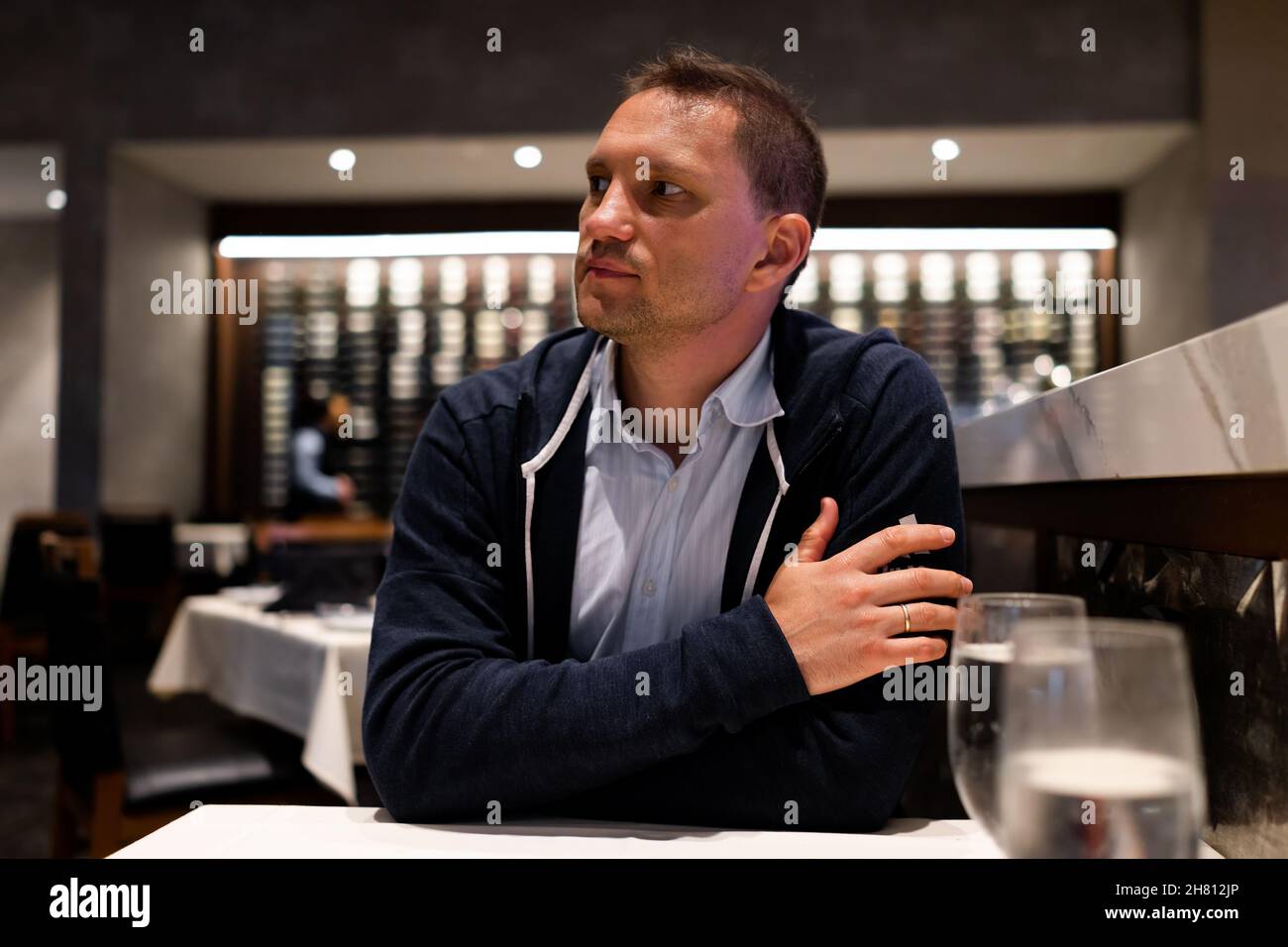 Man sitting alone at dinner table hi-res stock photography and images ...