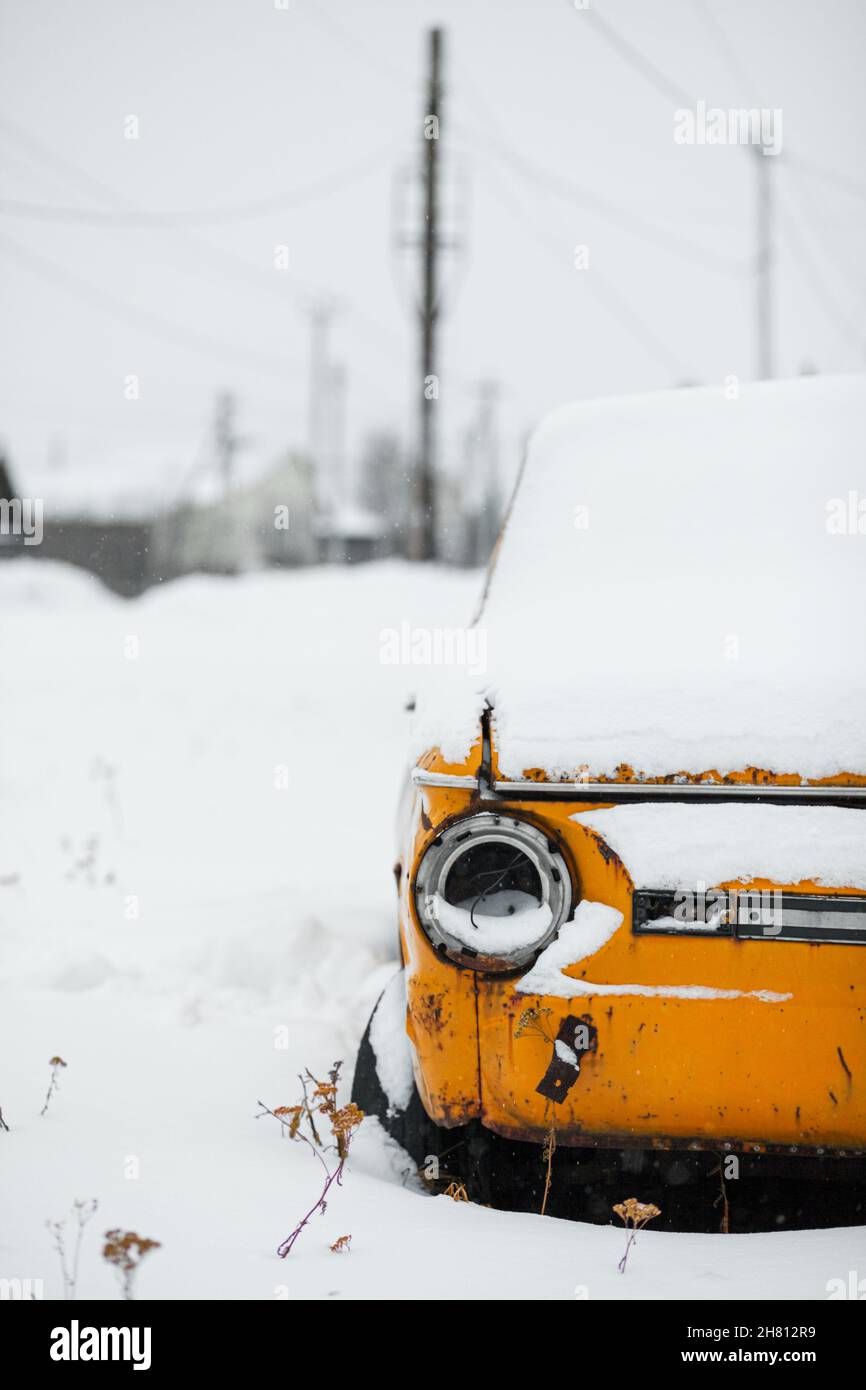Old yellow wrecked car in vintage style. Abandoned rusty yellow car ...