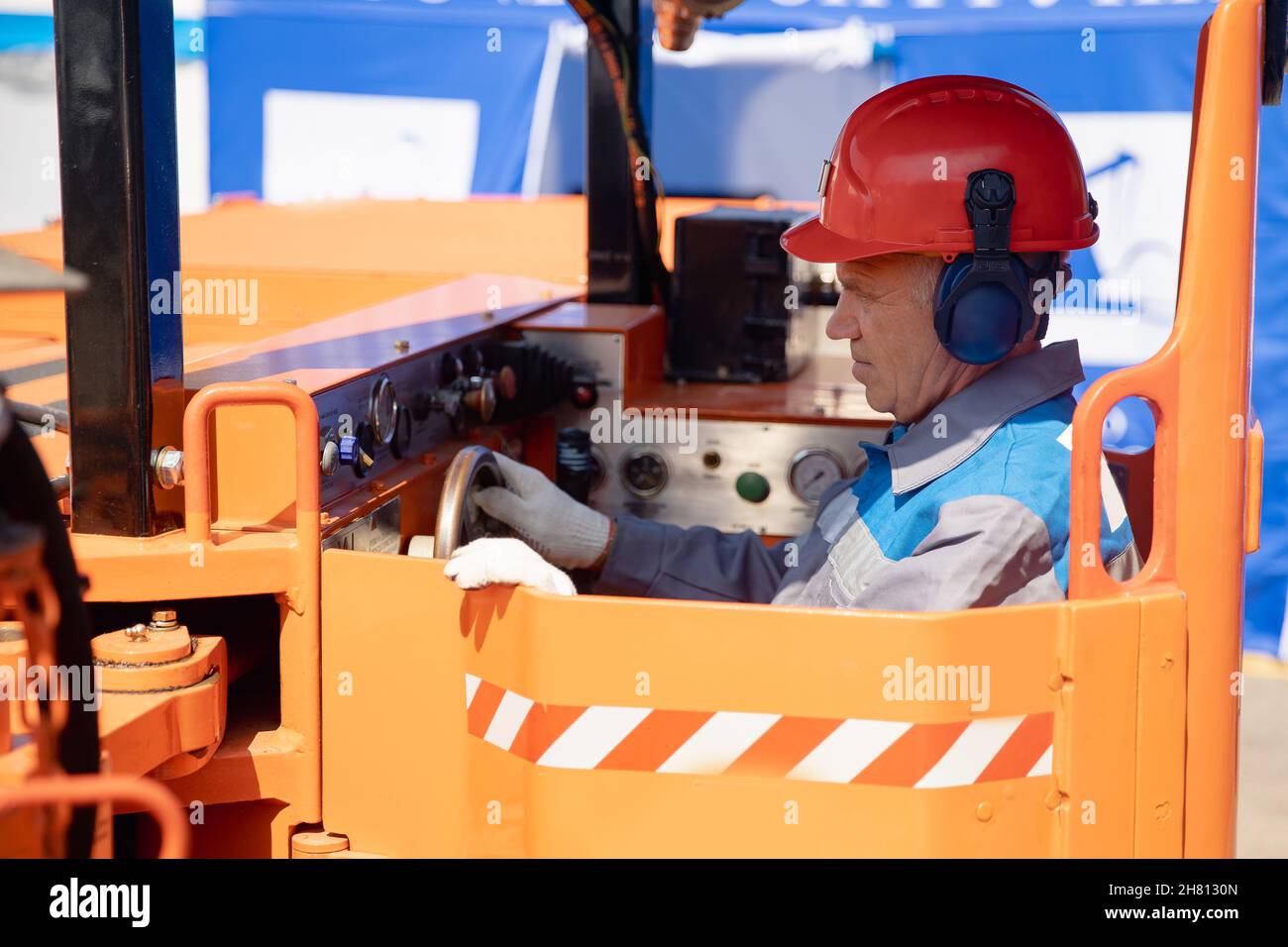 Driver man of construction equipment excavator or tractor. Builder or ...