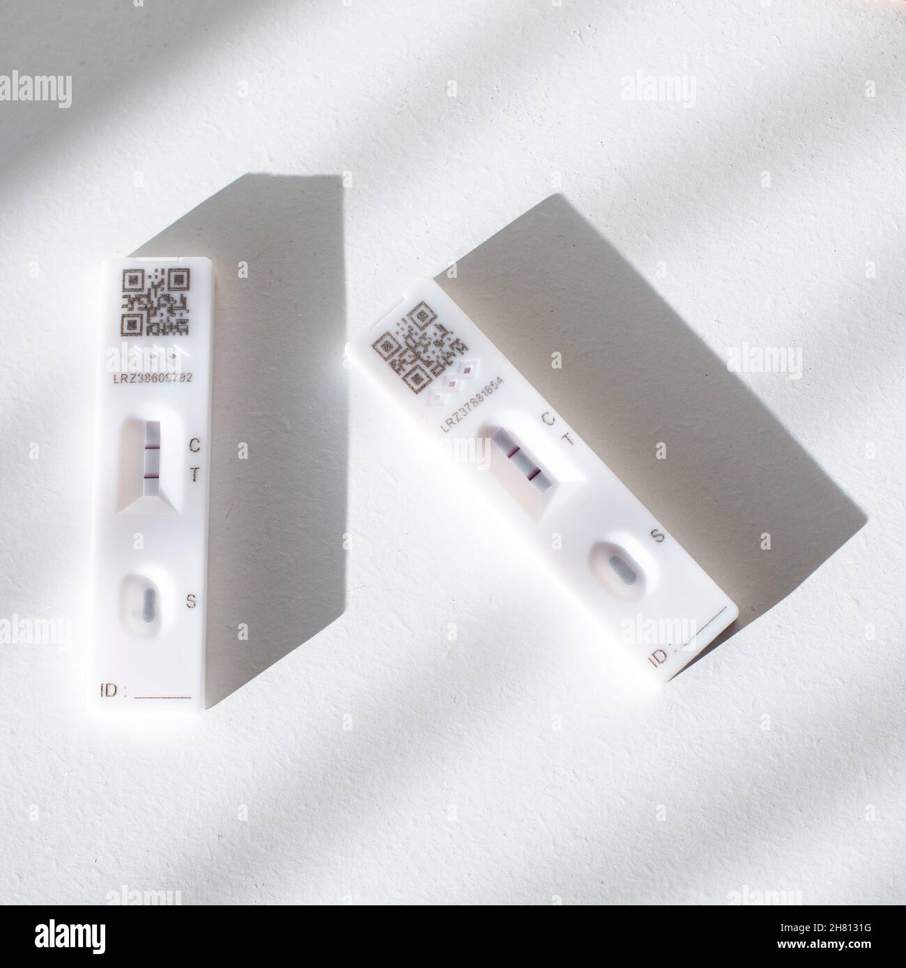 Two COVID-19 positive-reading lateral flow self-tests Stock Photo - Alamy