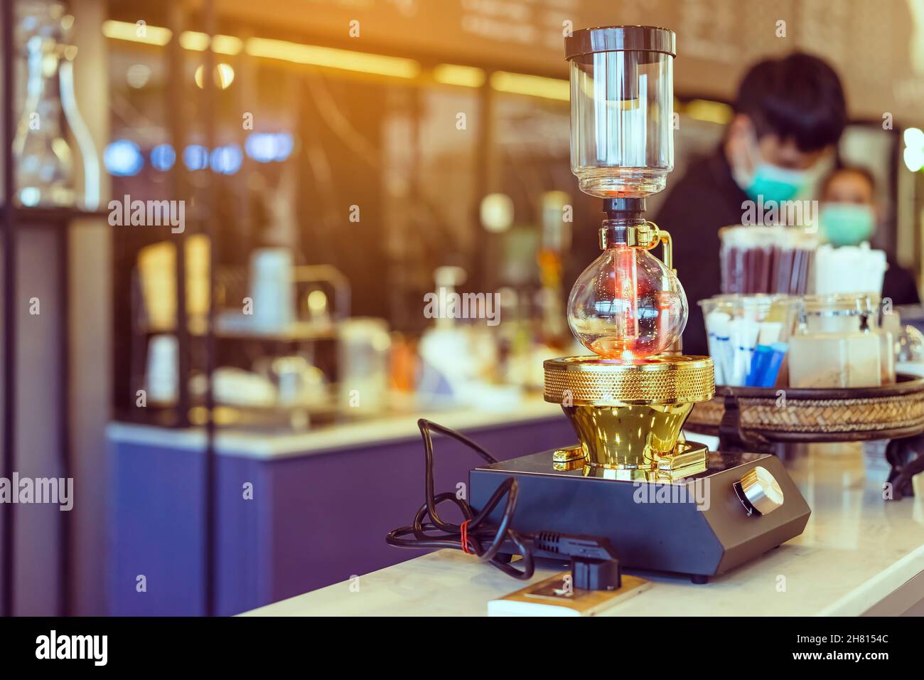 Close up to barista make coffee with Vacuum Pot Syphon Brewer. Syphon ...