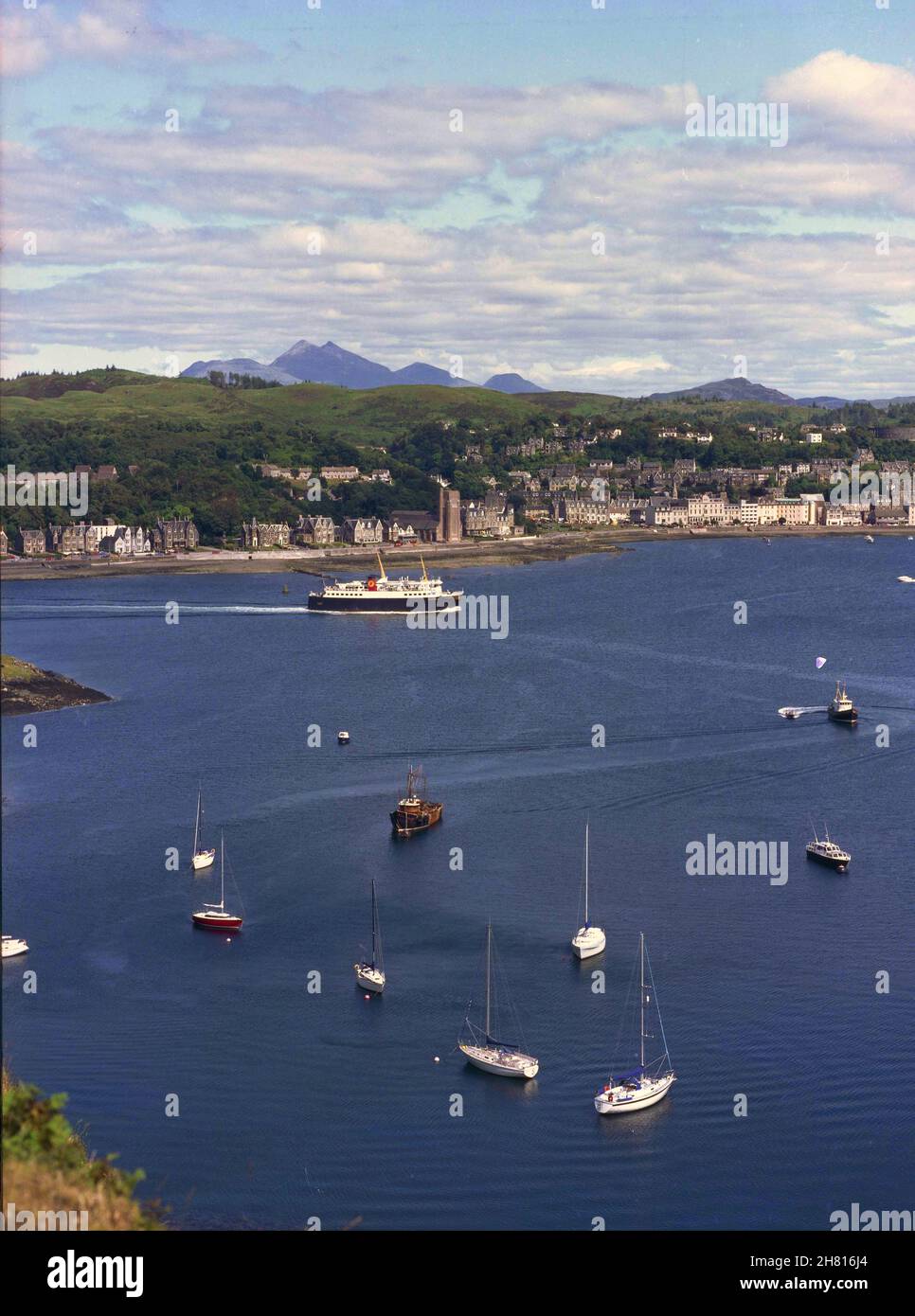 MV Caledonia in Oban bay 1970s with Ben Cruachan in view Stock Photo ...