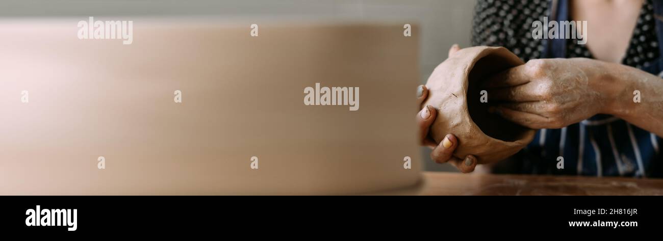 Modeling from clay or ceramics female hands making a vase. Clay ...