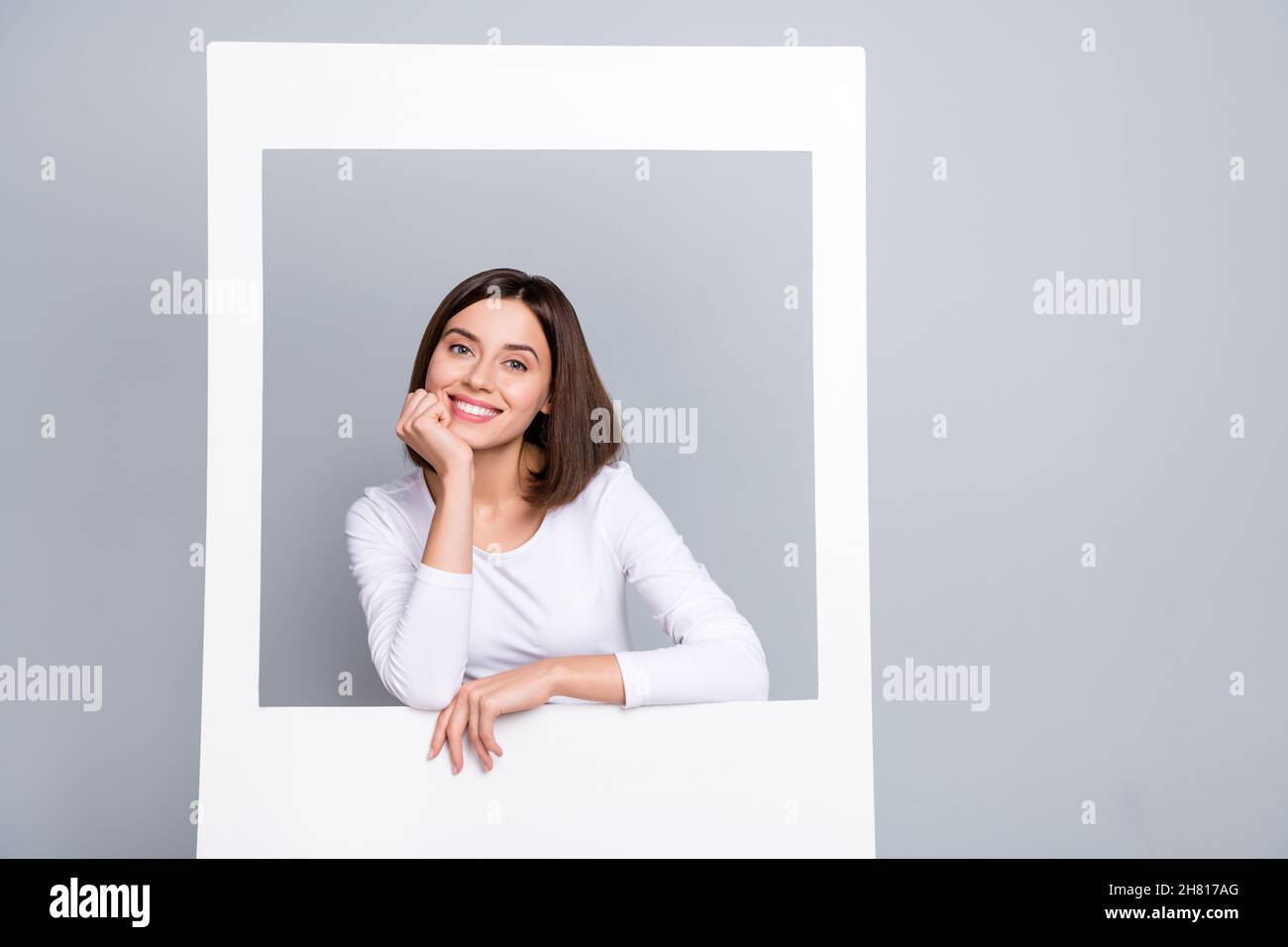 Photo of pretty dreamy young woman wear white outfit arm cheek tacking ...