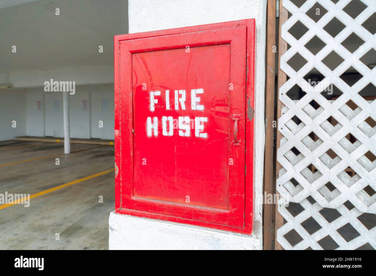 Red fire hose cabinet near the parking space ar Oceanside, California ...