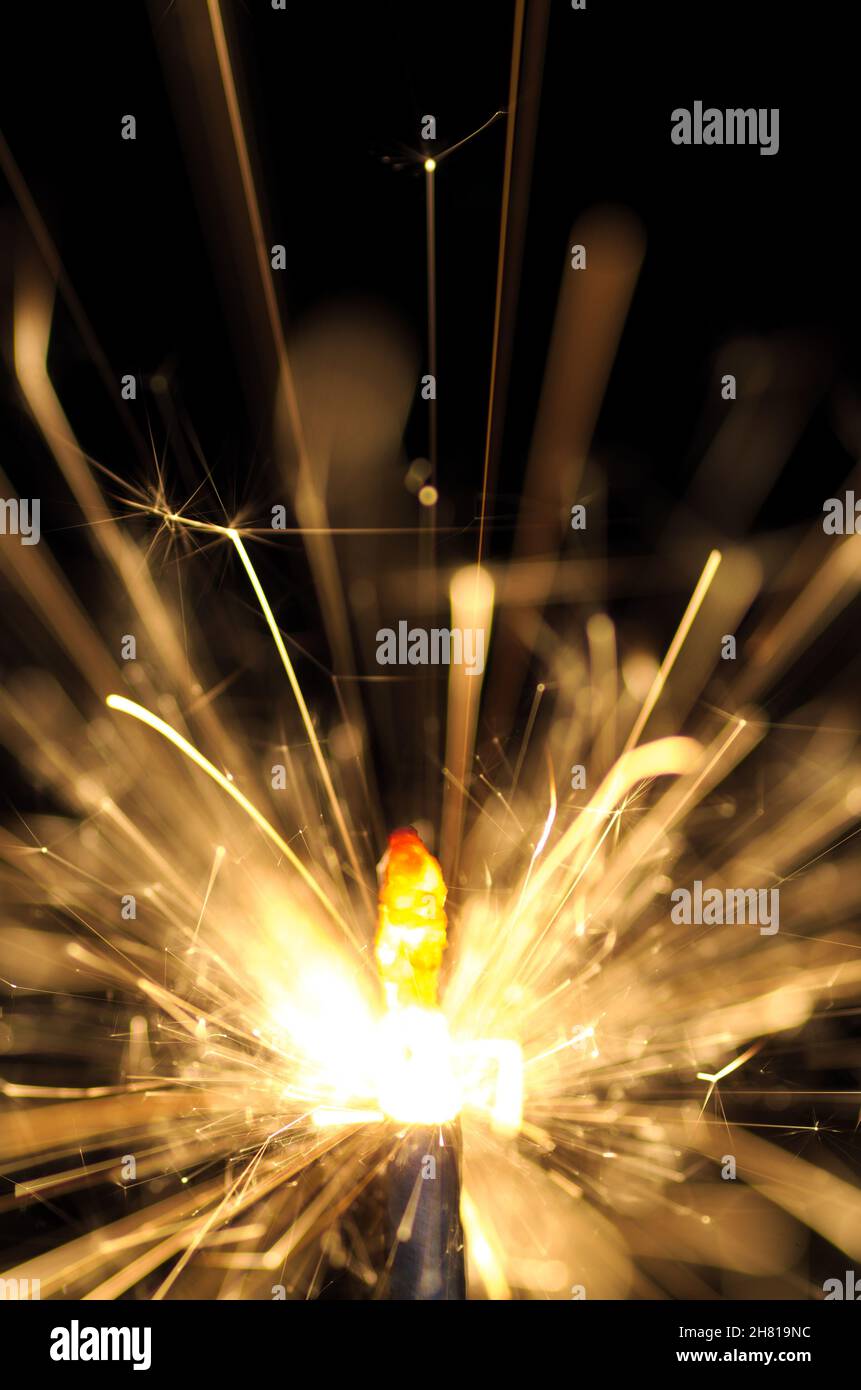 Sparkling sparkler, black background Stock Photo - Alamy
