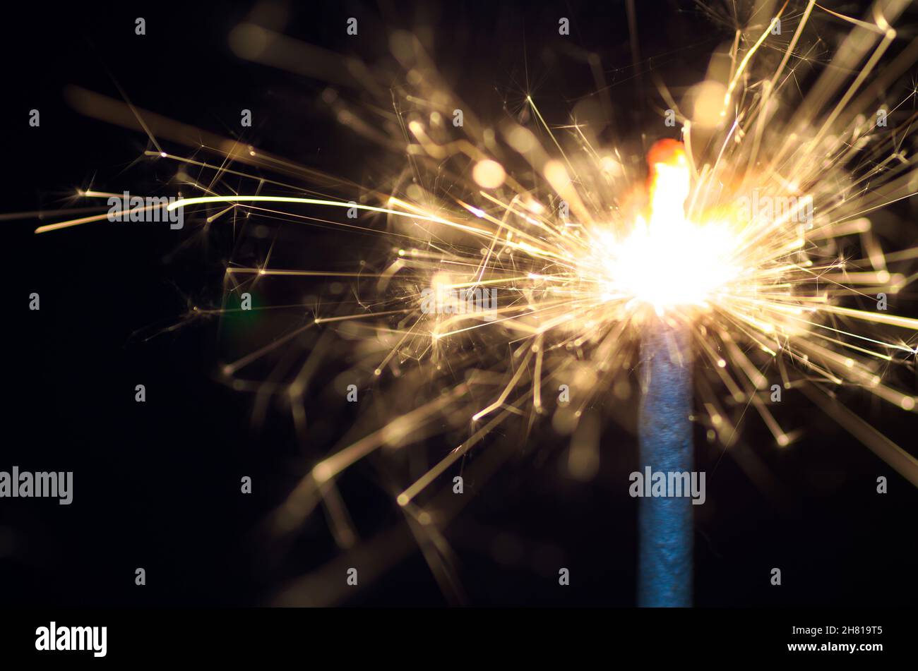 Sparkling sparkler, black background Stock Photo - Alamy