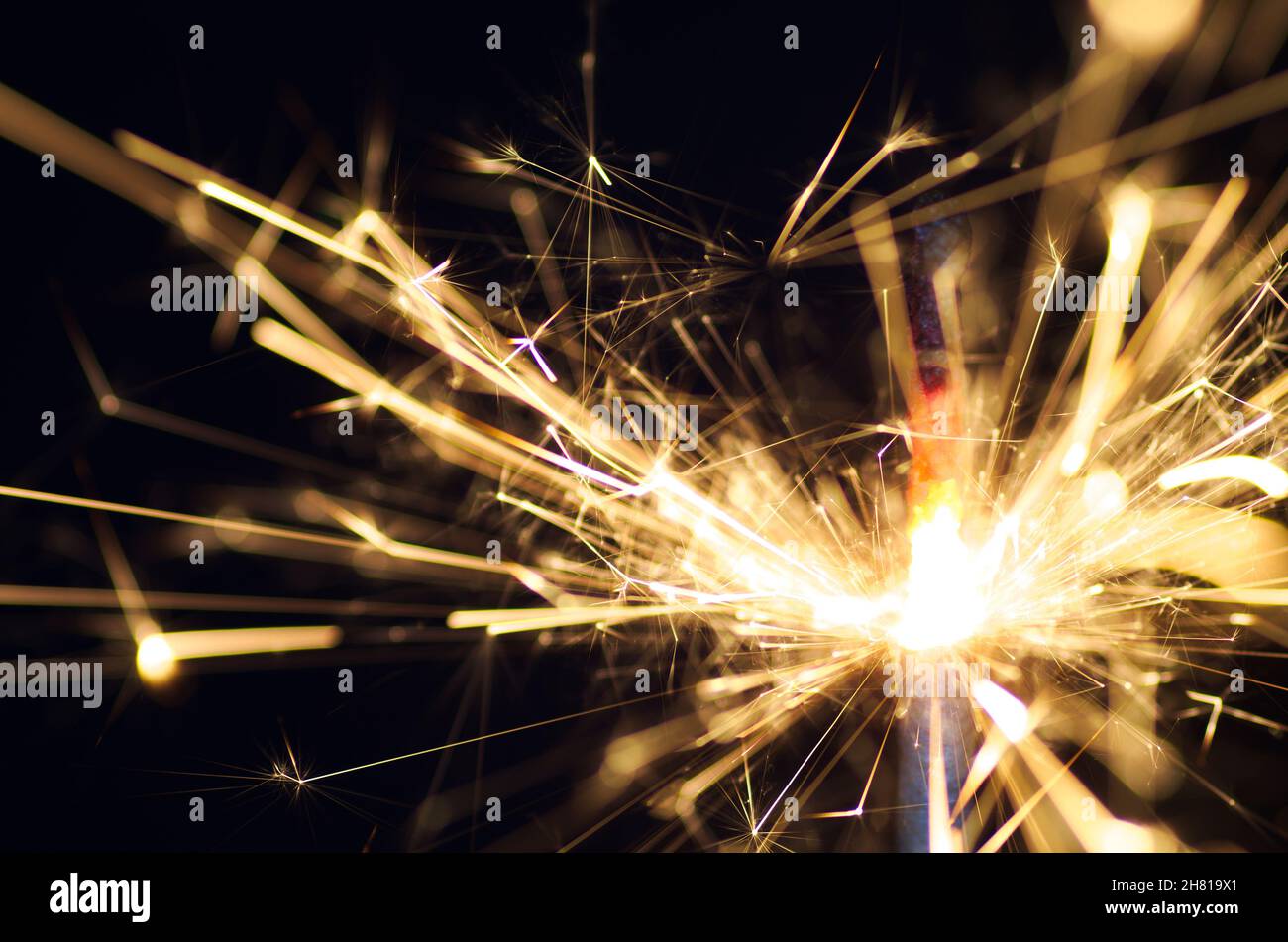 Sparkling sparkler, black background Stock Photo - Alamy
