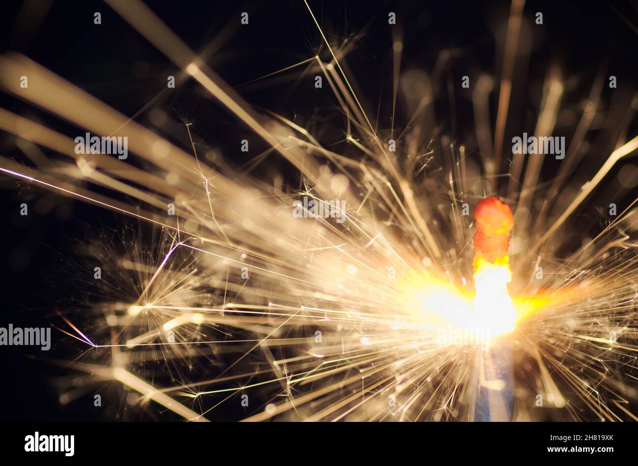 Sparkling sparkler, black background Stock Photo - Alamy