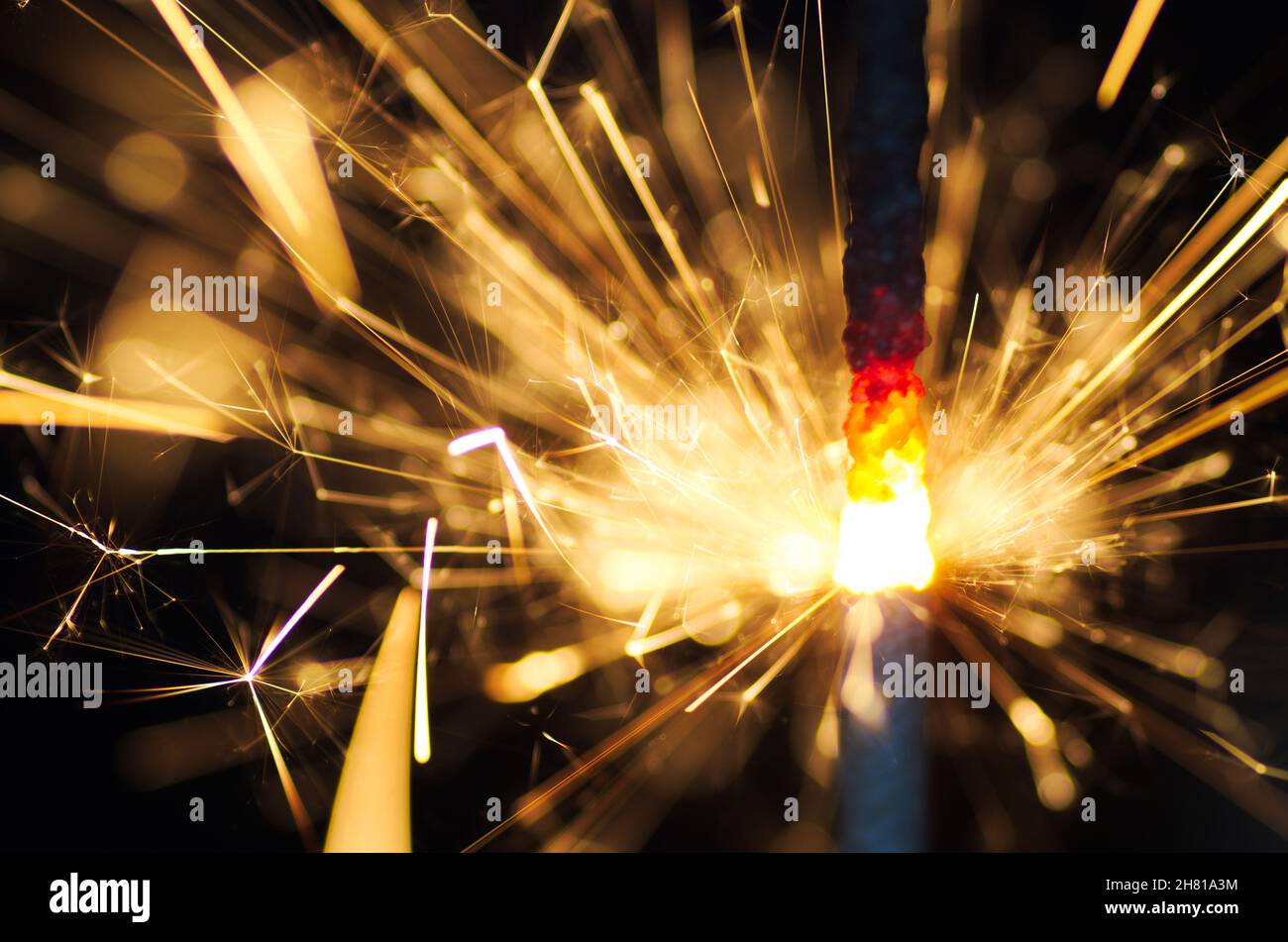 Sparkling sparkler, black background Stock Photo - Alamy