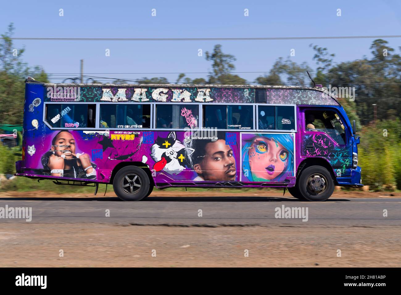 Bus with customised paintwork driving along Ngong road. Many buses in ...
