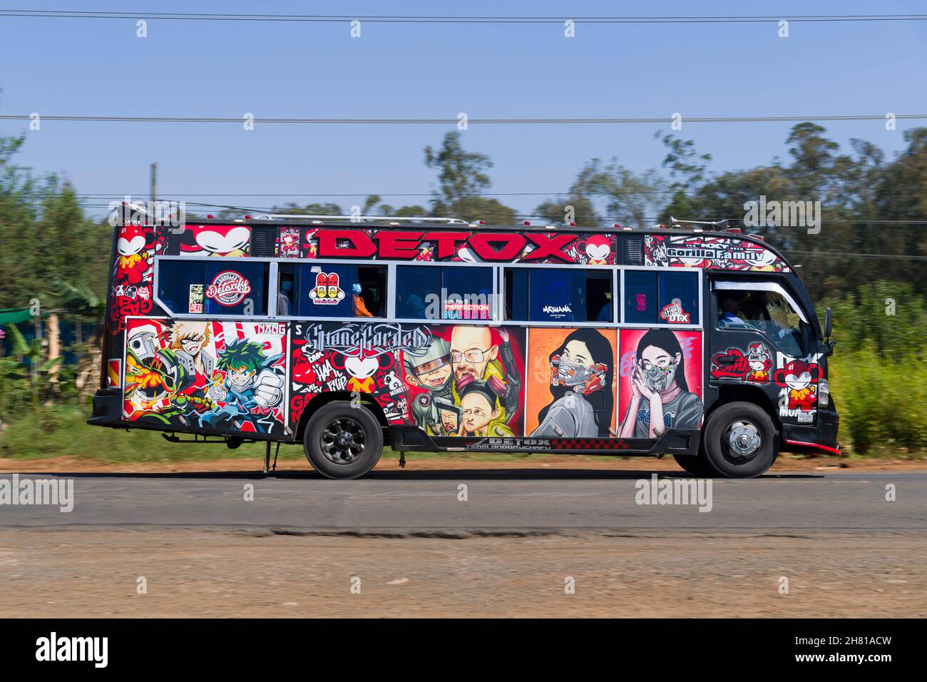 Bus with customised paintwork driving along Ngong road. Many buses in ...