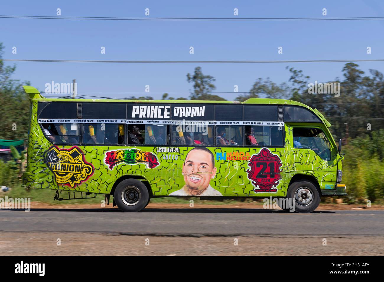 Bus with customised paintwork driving along Ngong road. Many buses in ...