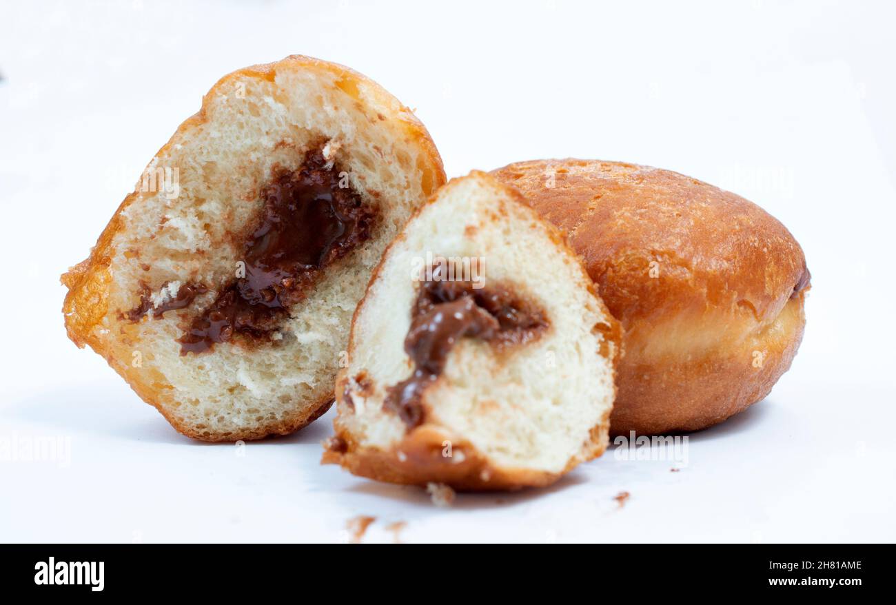 small round donuts with chocolate filling on white background Stock ...