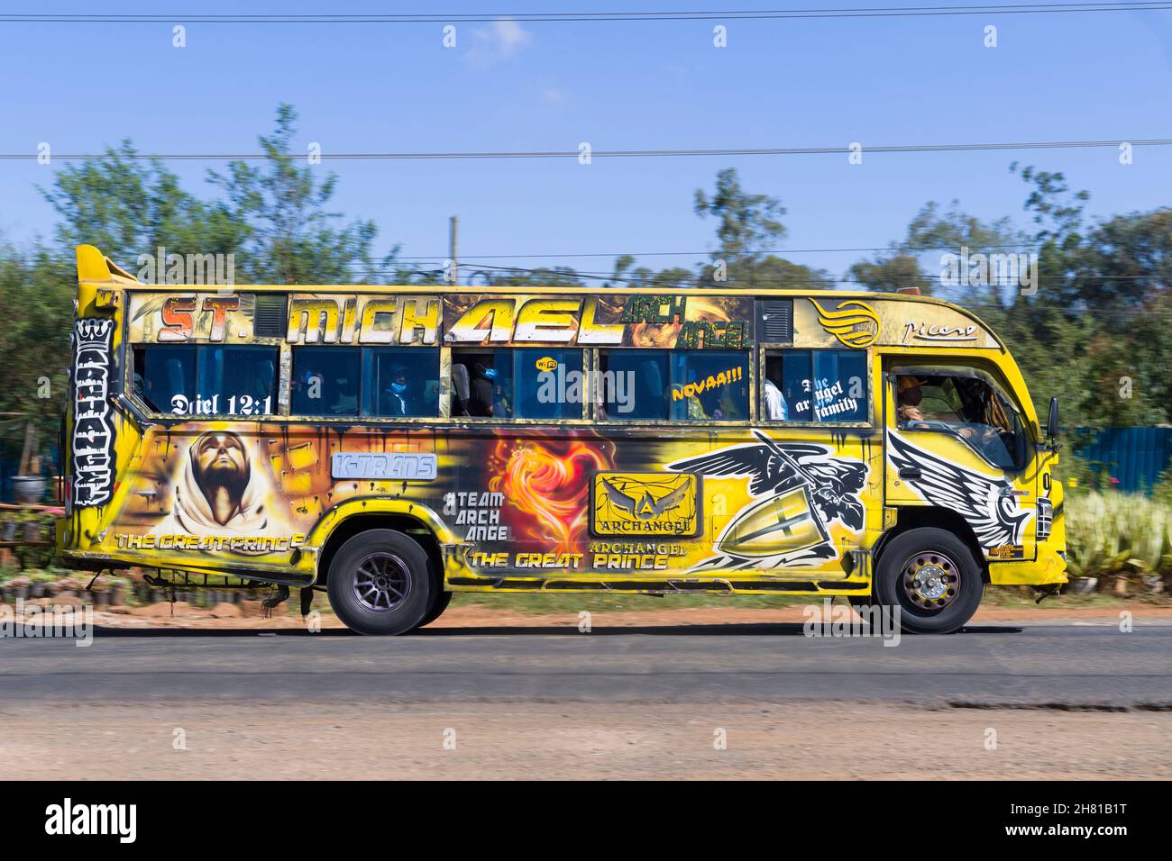 Bus with customised paintwork driving along Ngong road. Many buses in ...