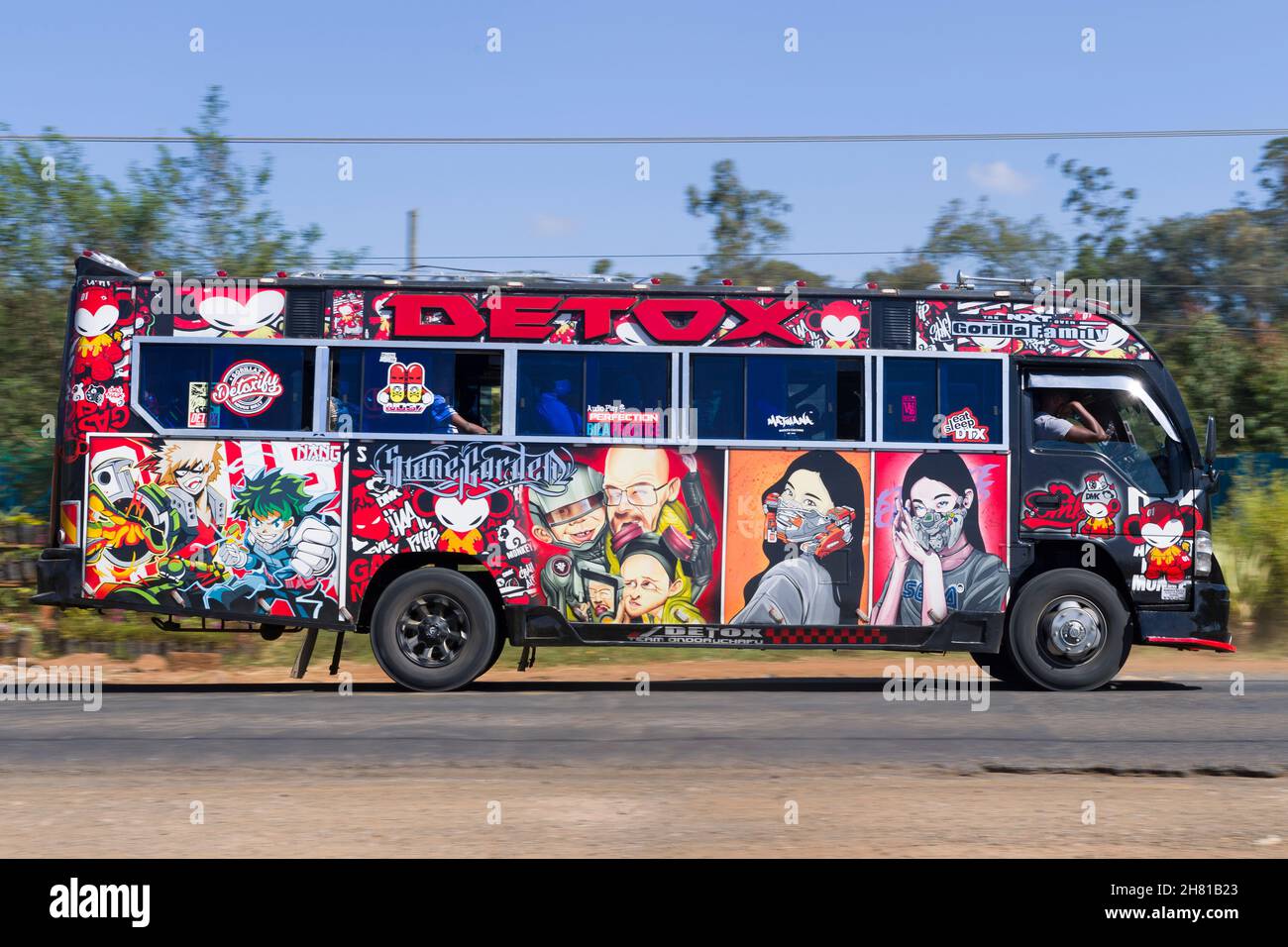 Bus with customised paintwork driving along Ngong road. Many buses in ...