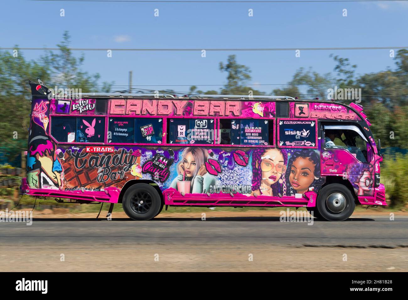 Bus with customised paintwork driving along Ngong road. Many buses in ...
