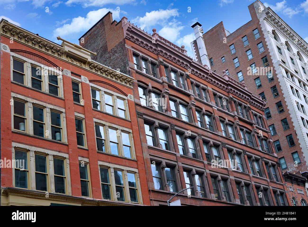 Old fashioned buildings preserved in the Chelsea district of Manhattan ...