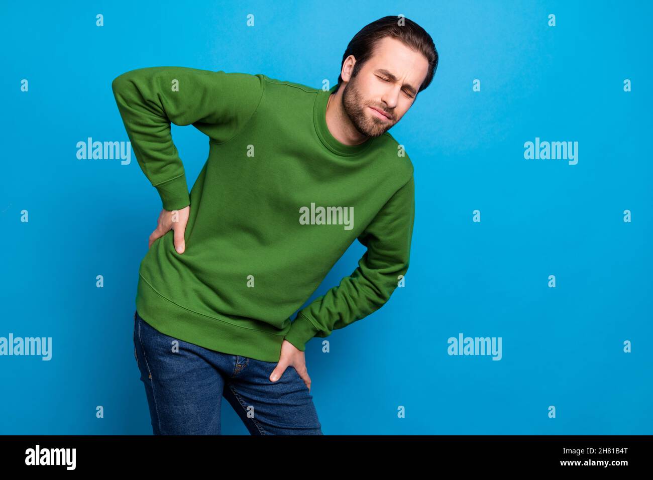 Photo of unsatisfied young person hand touch back closed eyes ...