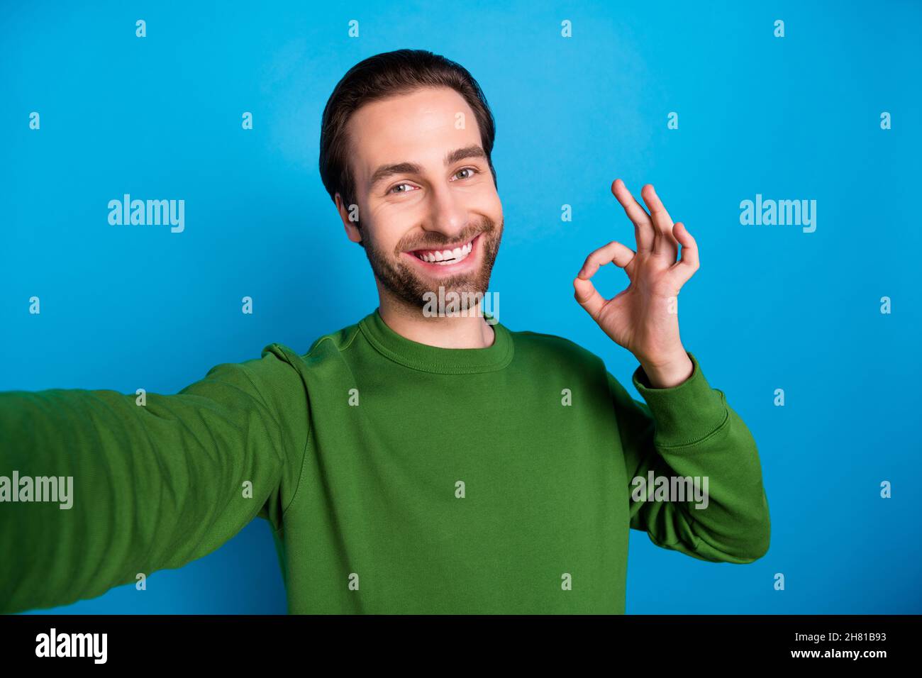 Photo of young good mood positive attractive guy take selfie showing ...