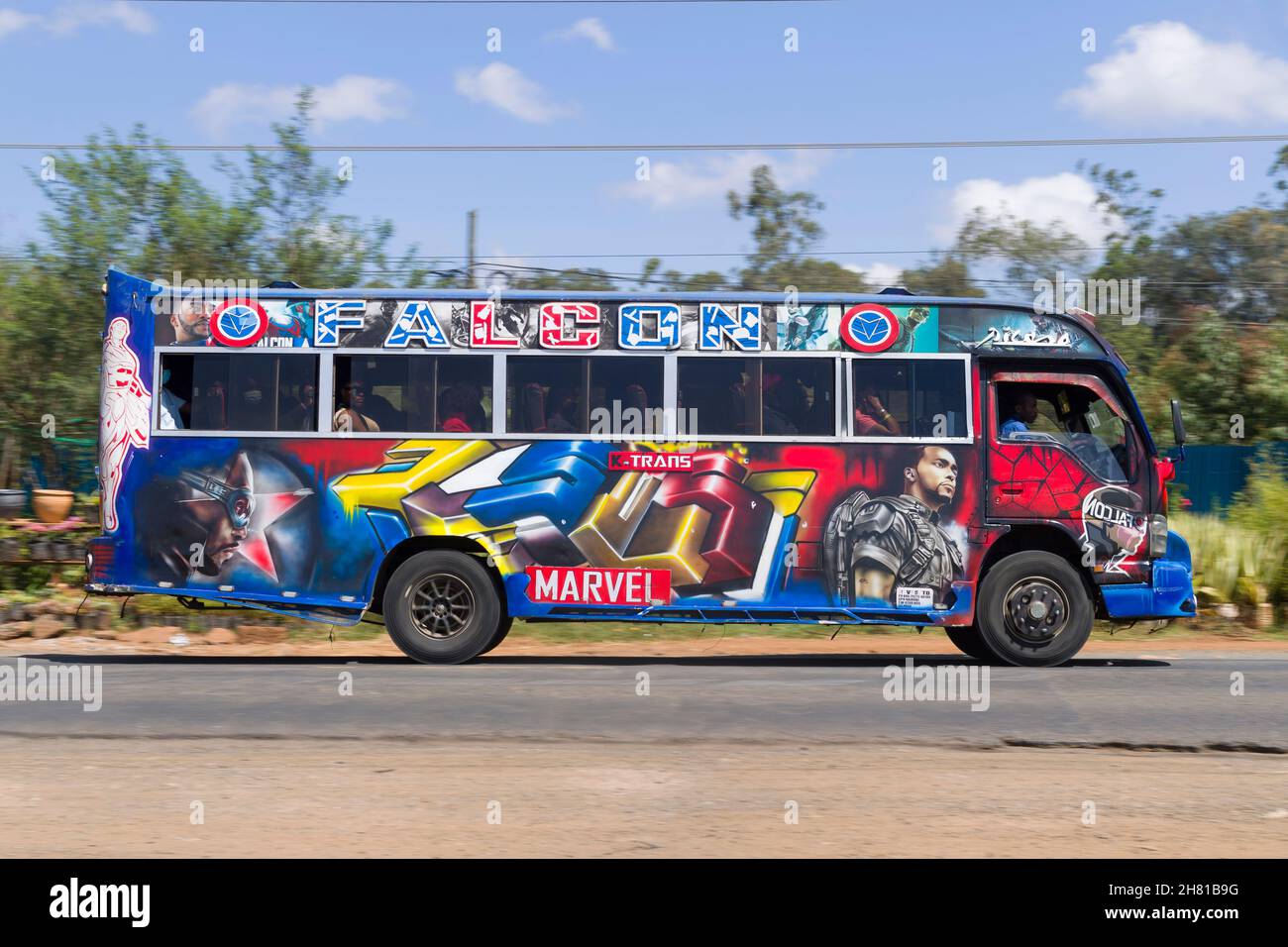 Bus with customised paintwork driving along Ngong road. Many buses in ...