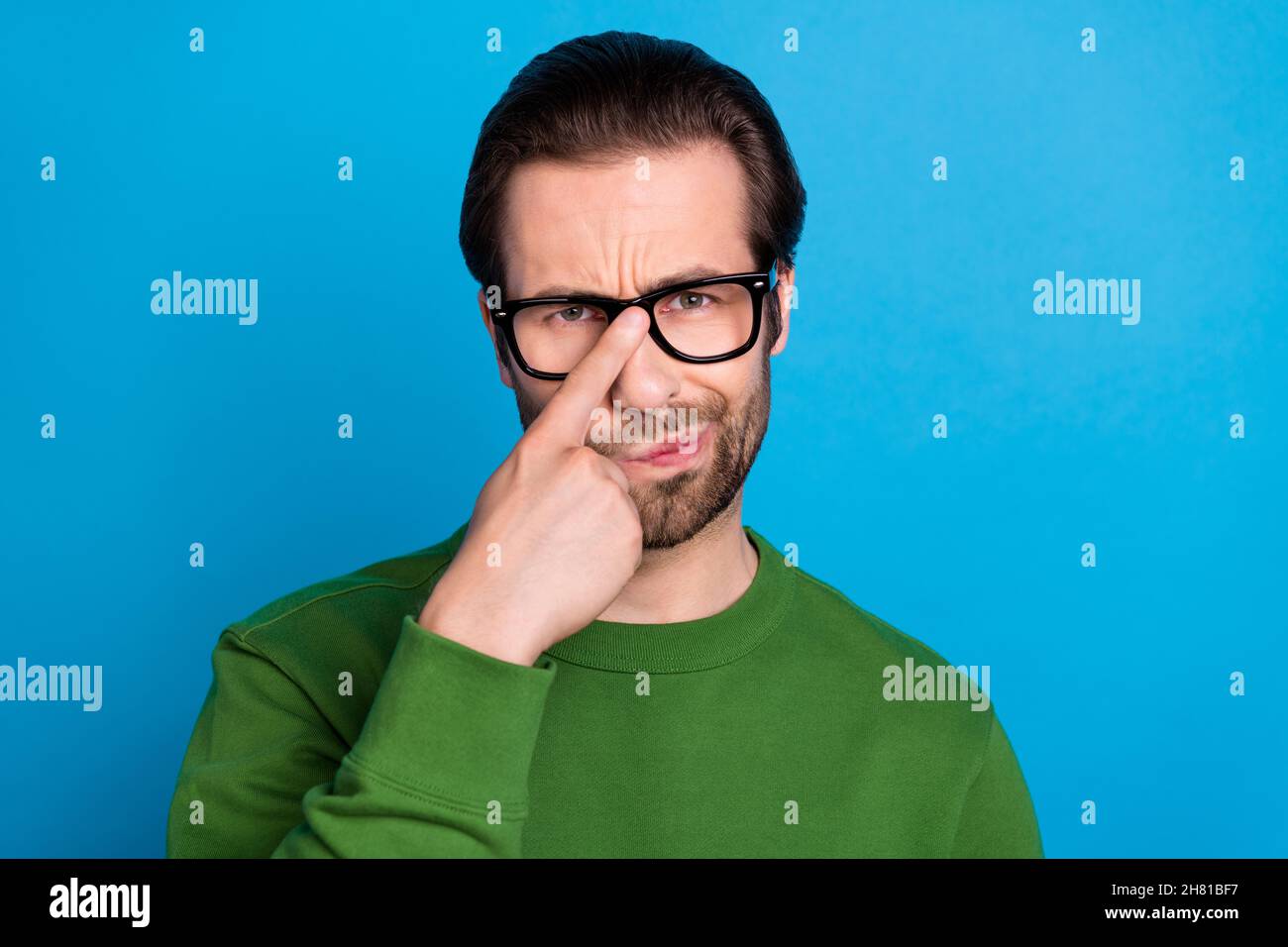 Photo of young unhappy upset negative mood man in glasses thinking ...
