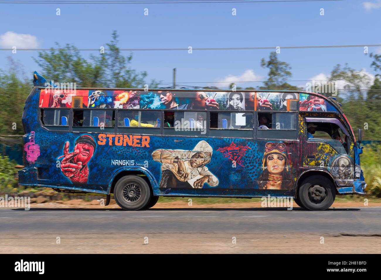 Bus with customised paintwork driving along Ngong road. Many buses in ...