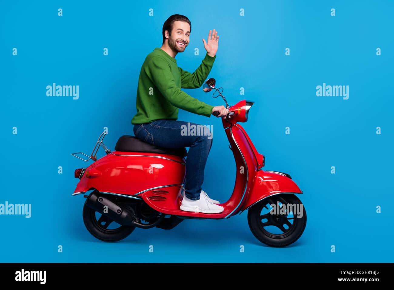 Full size profile side photo of smiling cheerful male ride fast in ...