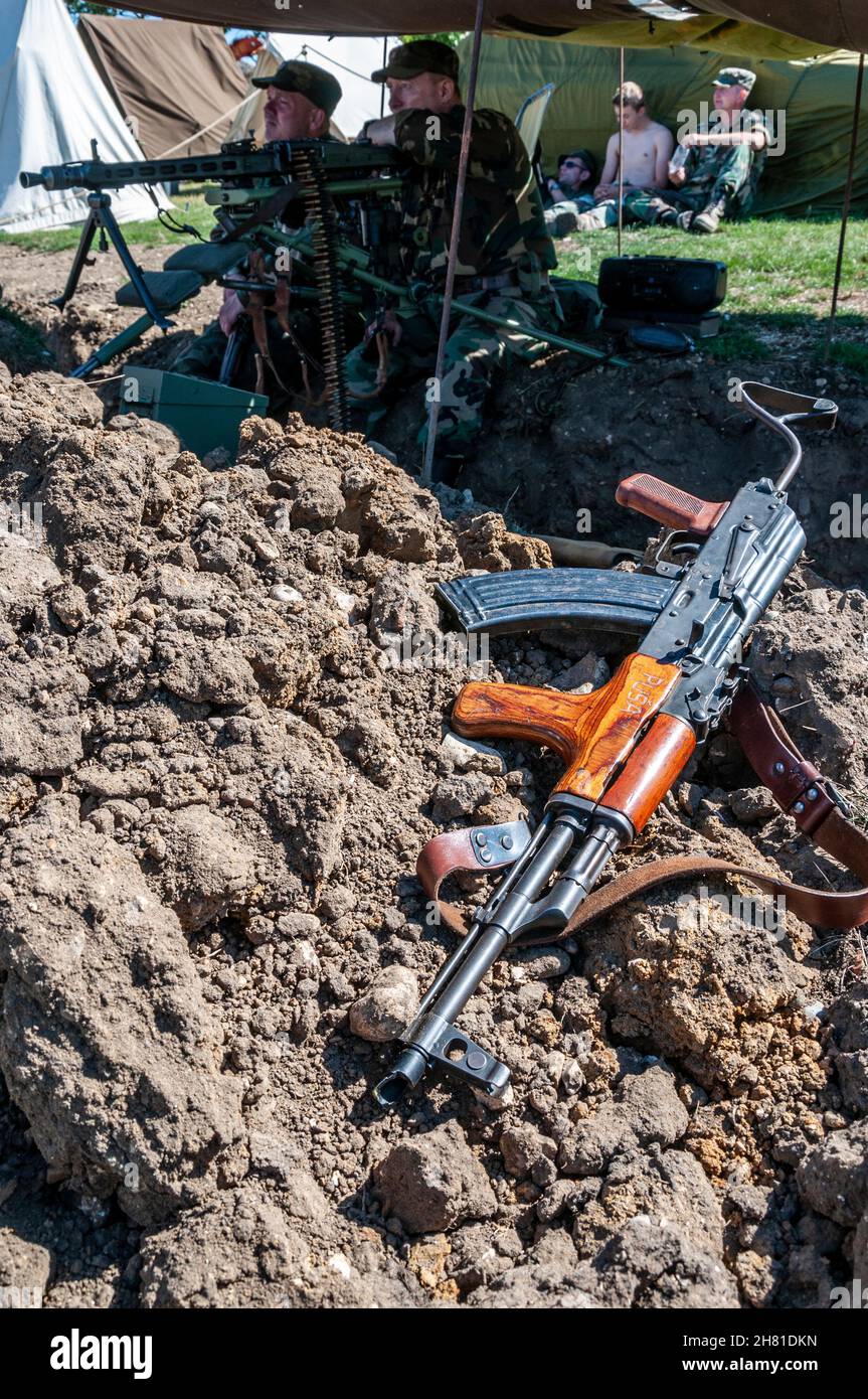 Vietnam War re-creation. GPMG dugout with a Type 56 assault rifle in ...