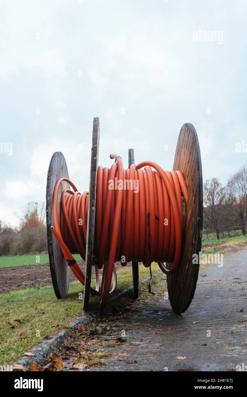 Two fiber optic conduit reels with speed pipes in a rural area near ...
