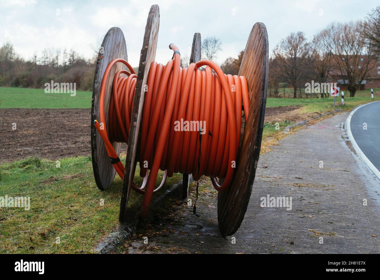 Two fiber optic conduit reels with speed pipes in a rural area near ...