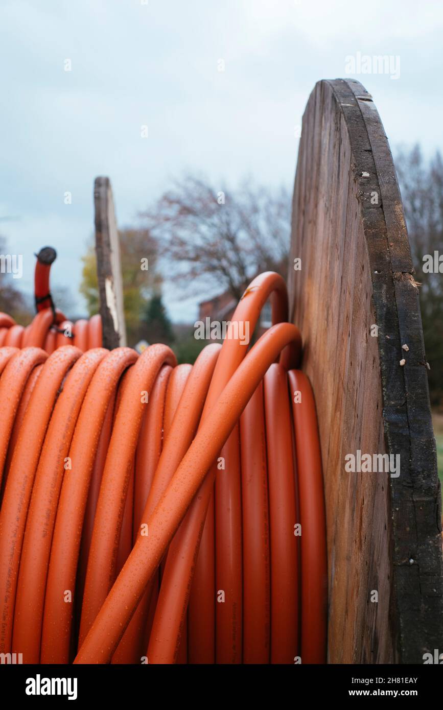 Two fiber optic conduit reels with speed pipes in a rural area near ...