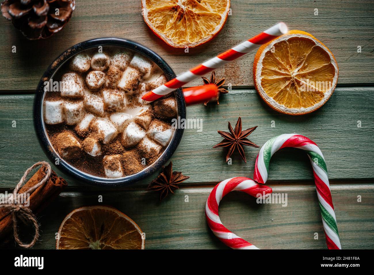 Christmas banner with a cup of hot chocolate, fir tree branches, candy ...