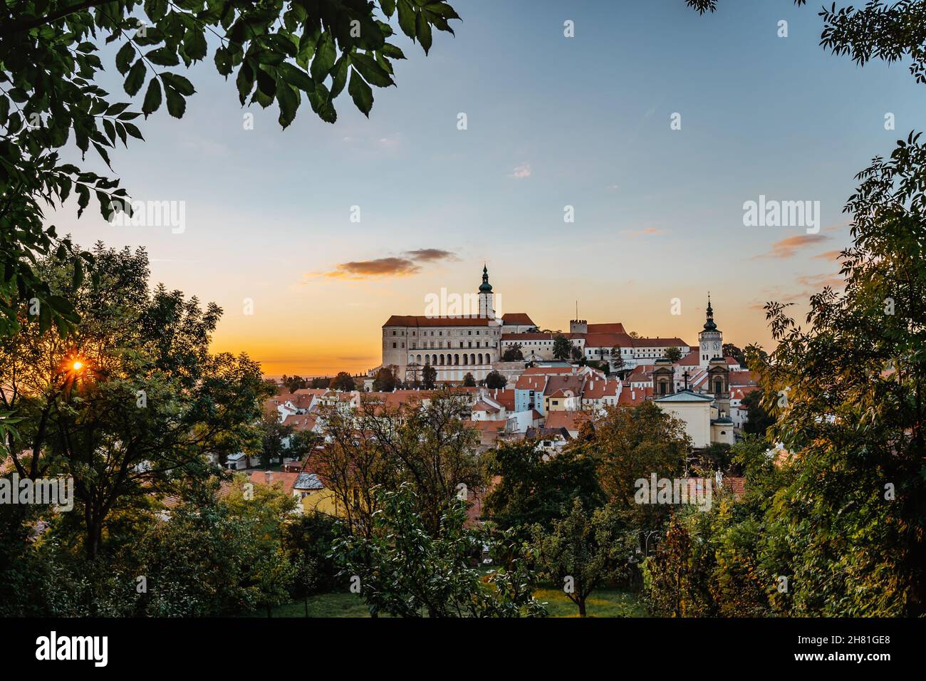 View of Mikulov with beautiful Baroque castle on the rock at sunset ...