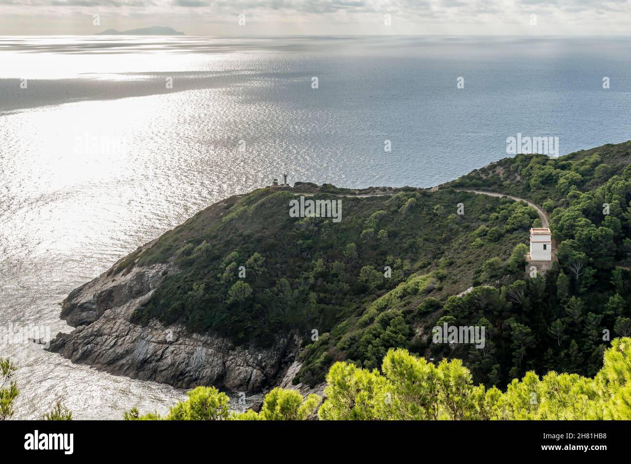 A glimpse of the island of Gorgona with the island of Capraia in the ...